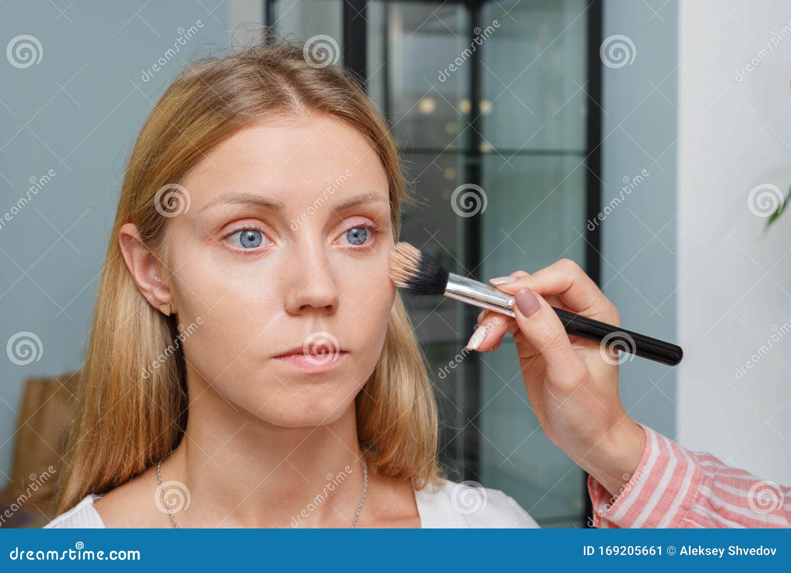 The Process of Creating Makeup. Makeup Artist Working with a Brush on ...