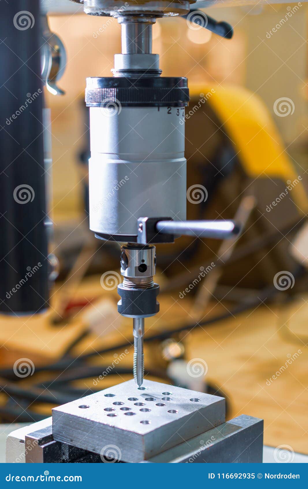 The Process of Cutting a Metric Thread Using a Machine Tap. Stock Image ...