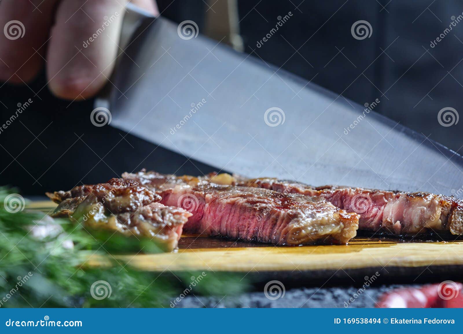 The Process of Cutting a Steak into Pieces Close-up. Beef Steak Medium ...