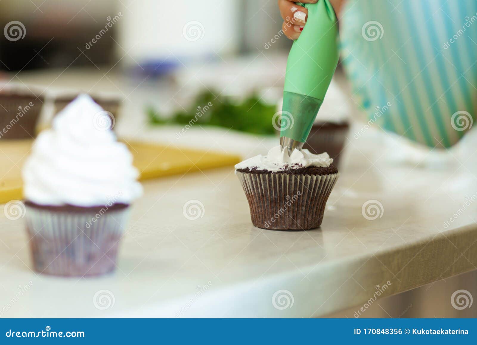 The Process of Decorating Chocolate Cupcakes with Airy Protein Cream ...