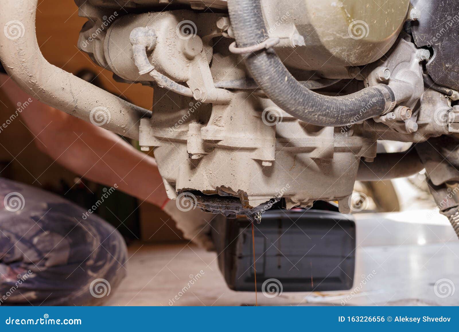 The Process of Draining Oil from a Motorcycle Engine. Engine Oil ...