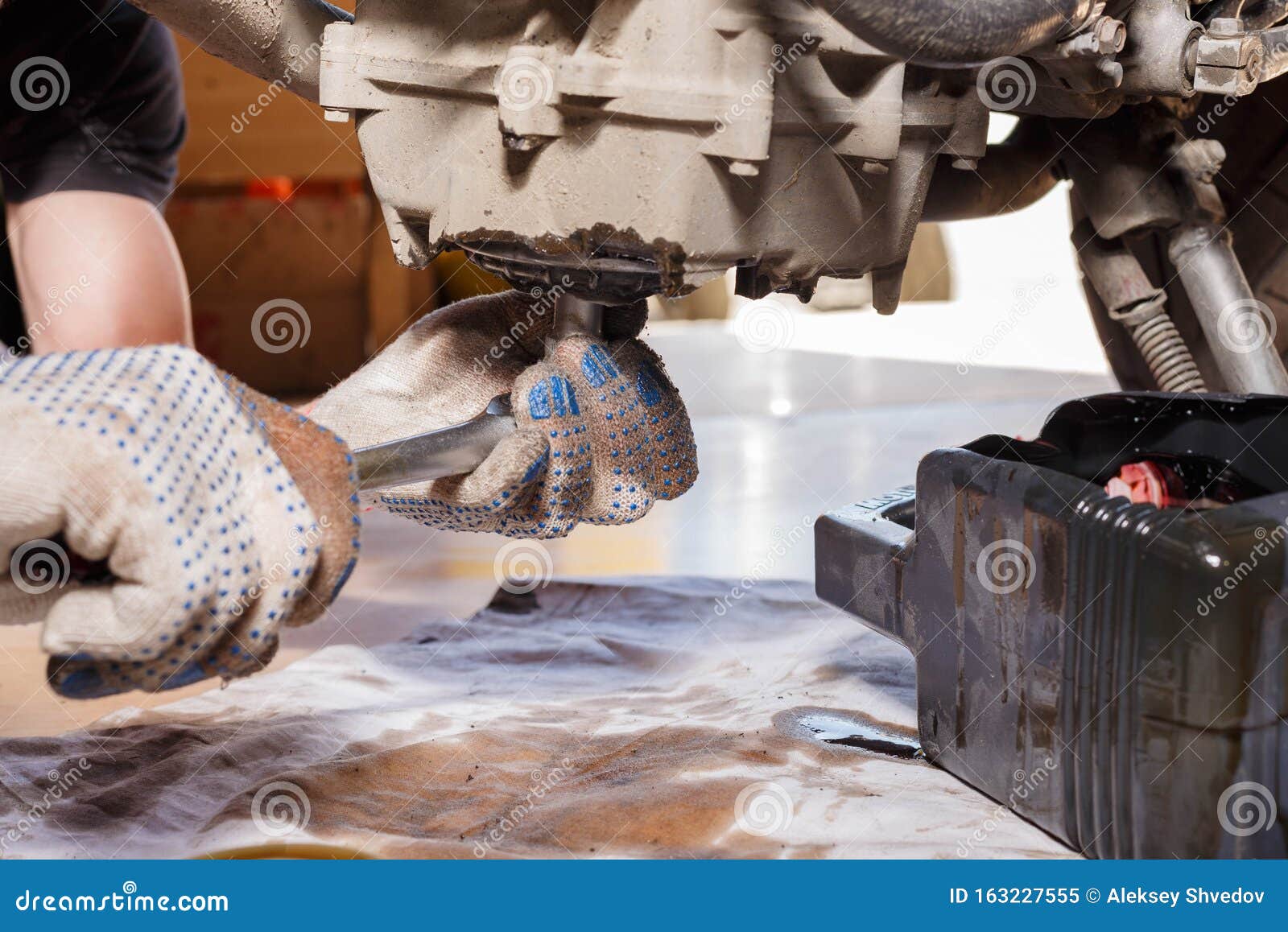 The Process of Draining Oil from a Motorcycle Engine. Engine Oil ...