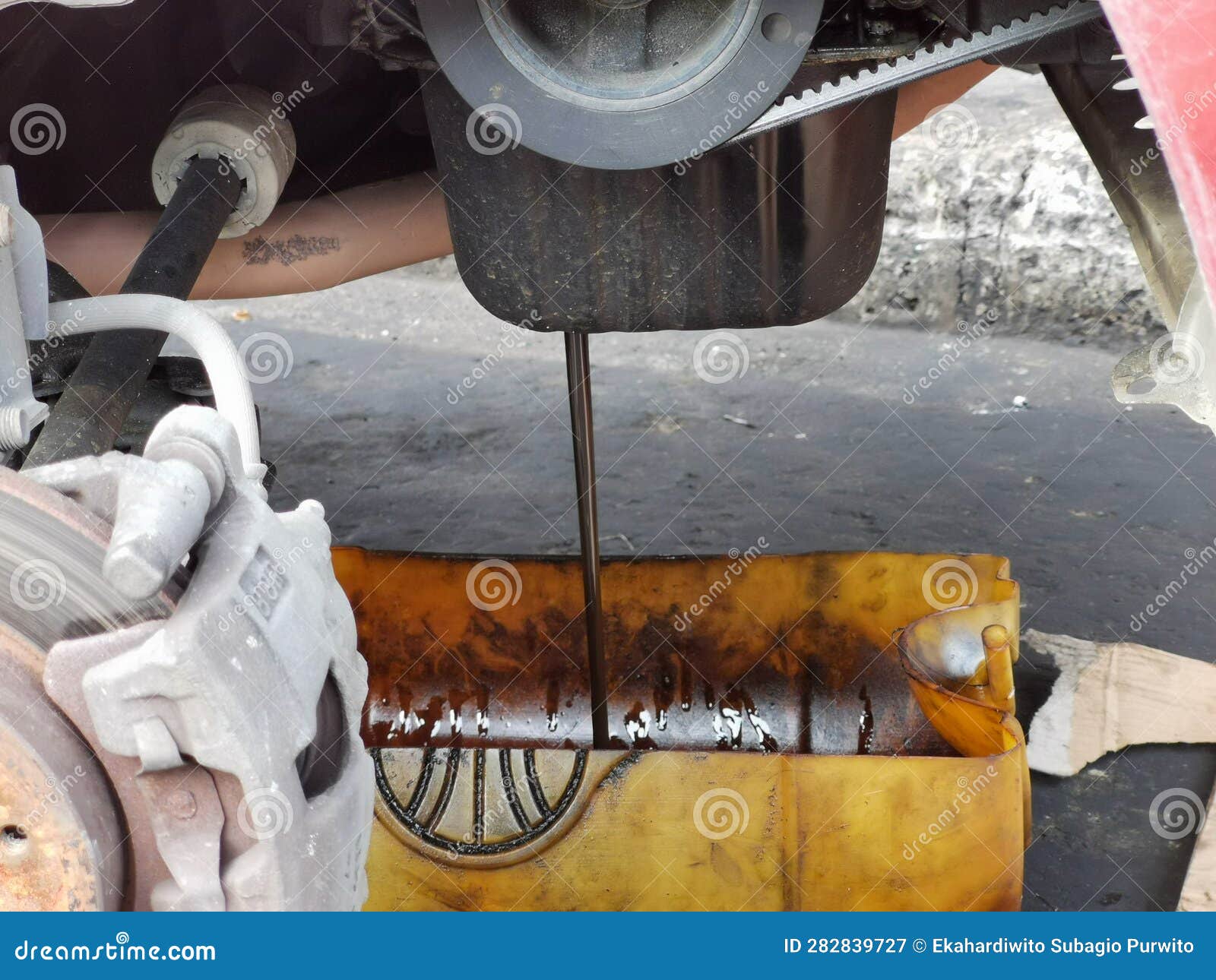 Process of Draining Old Dark Used Engine Oil. Stock Image - Image of ...