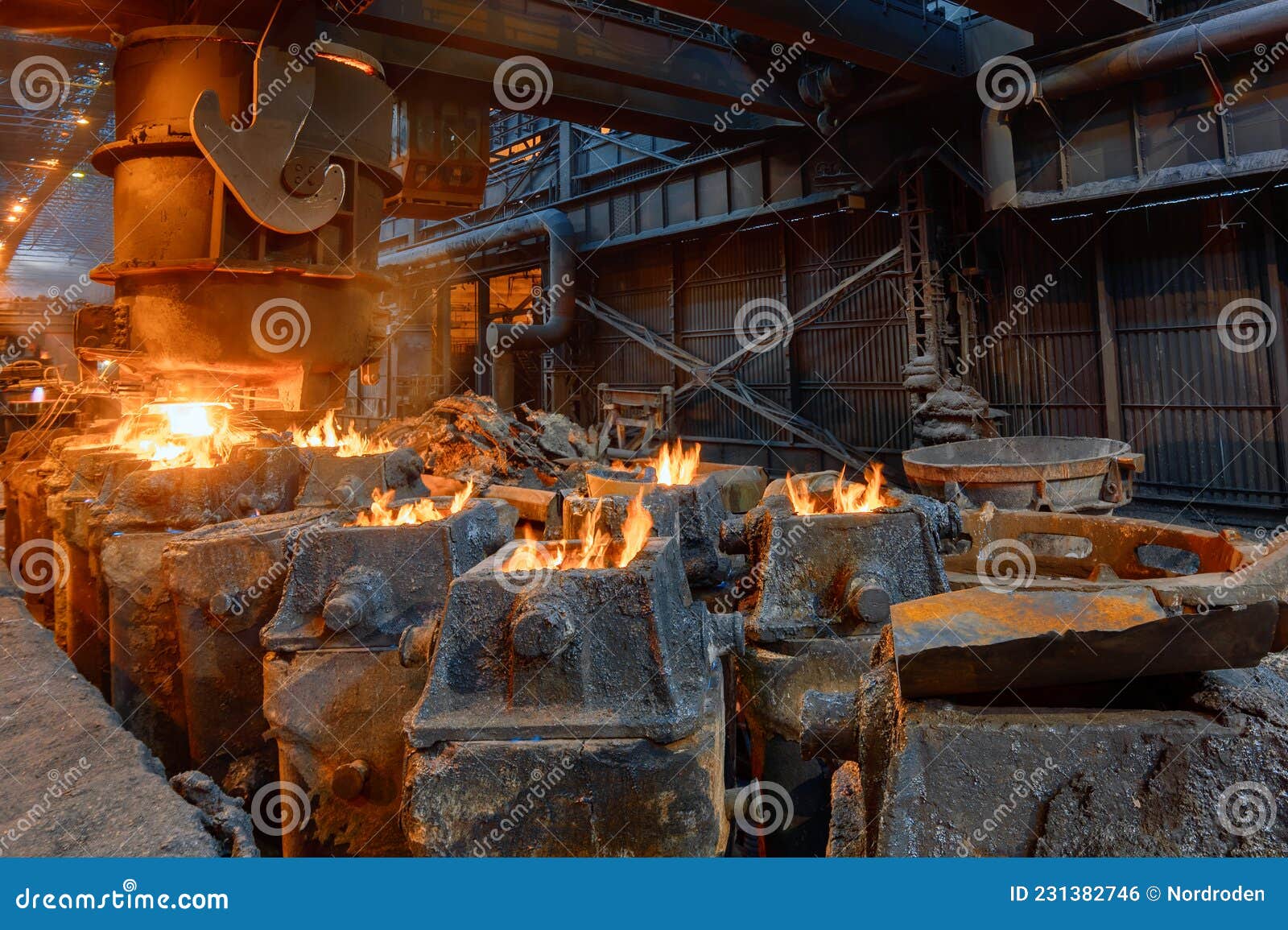 The Process of Filling Liquid Metal into Steel Molds Stock Photo ...
