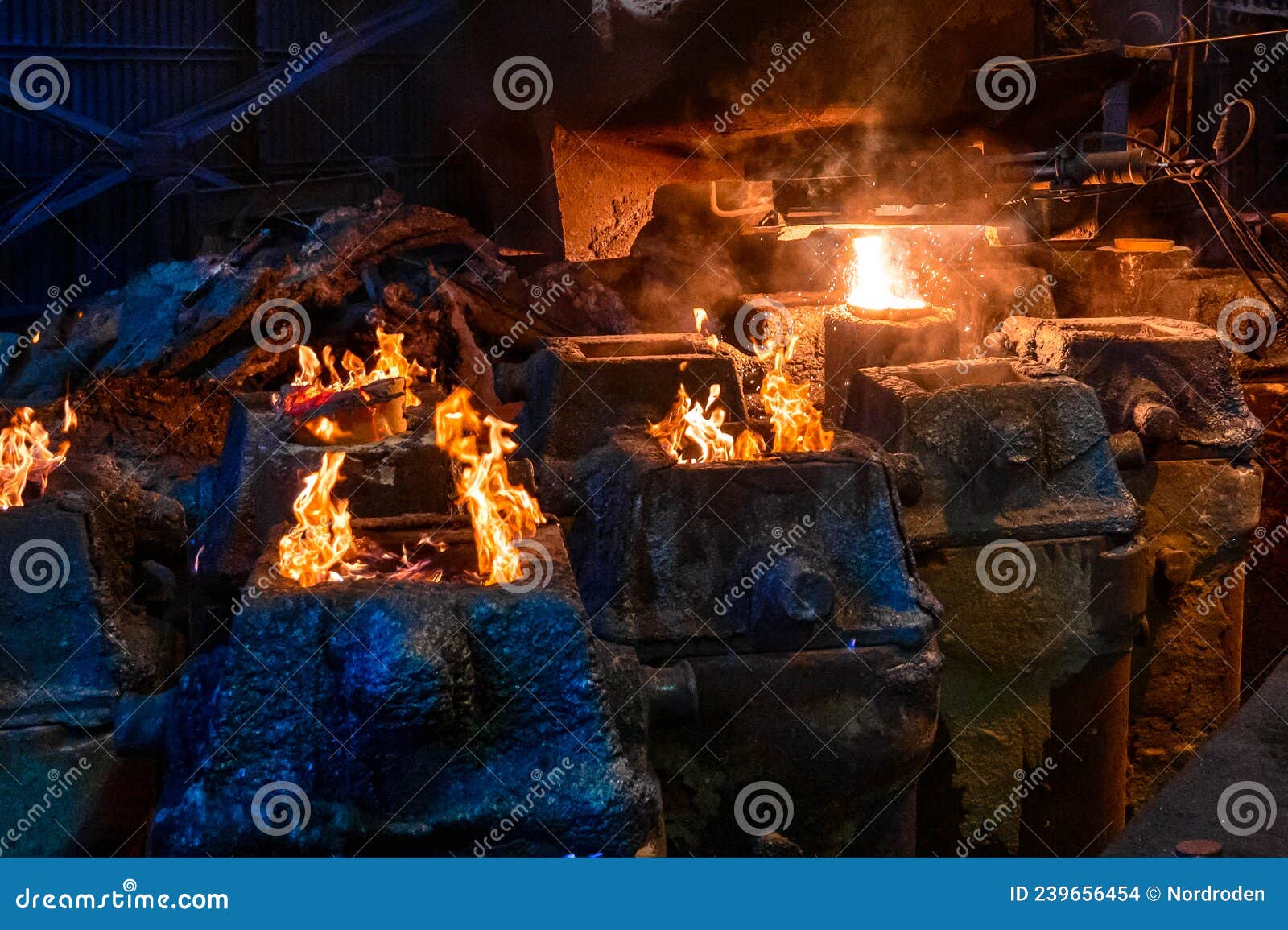 The Process of Filling Liquid Metal with Steel Molds Stock Photo ...