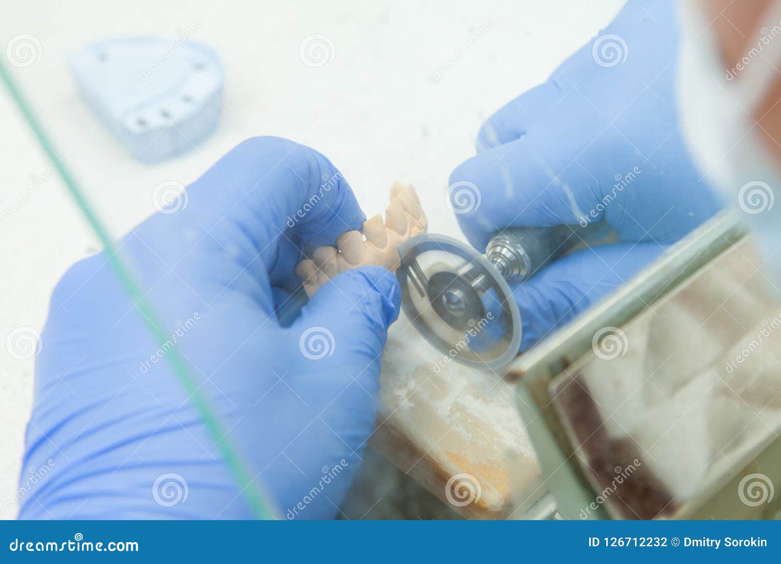 Process of Grinding the Jaw during Production. the Dental Technician ...