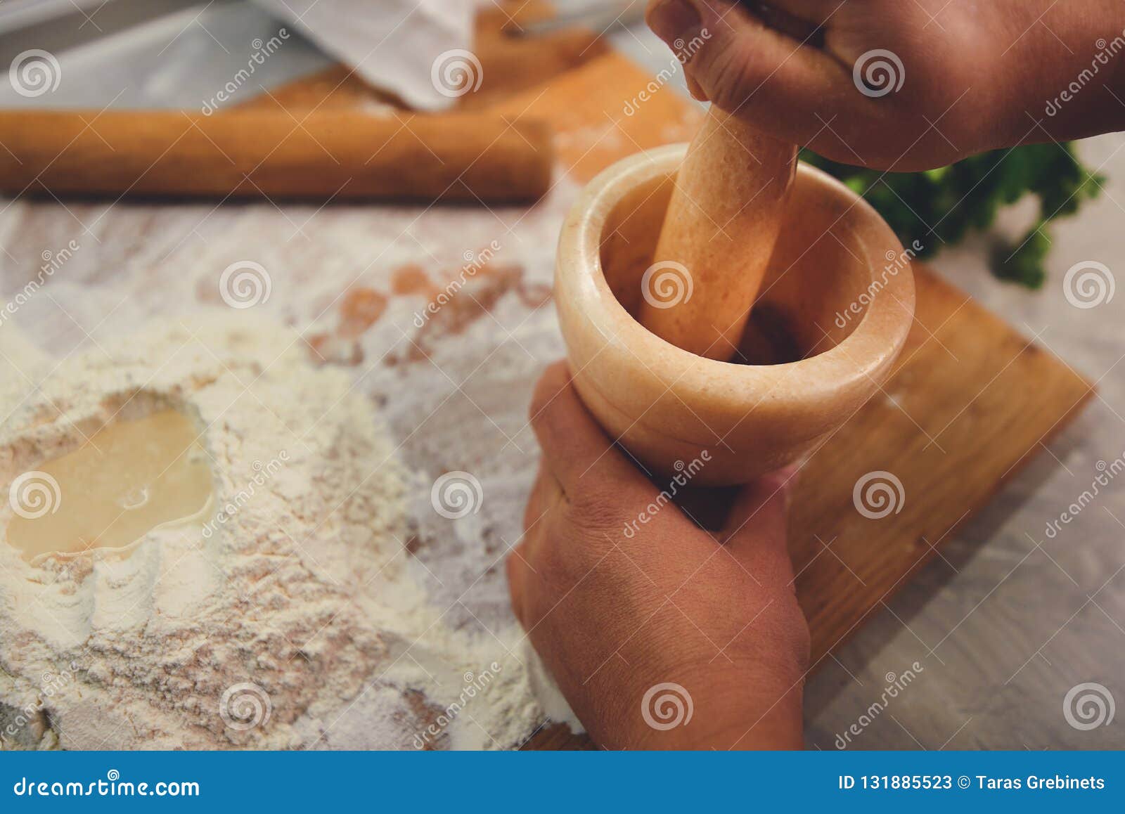 The Process of Grinding Spices in a Stone Mortar Stock Image - Image of ...