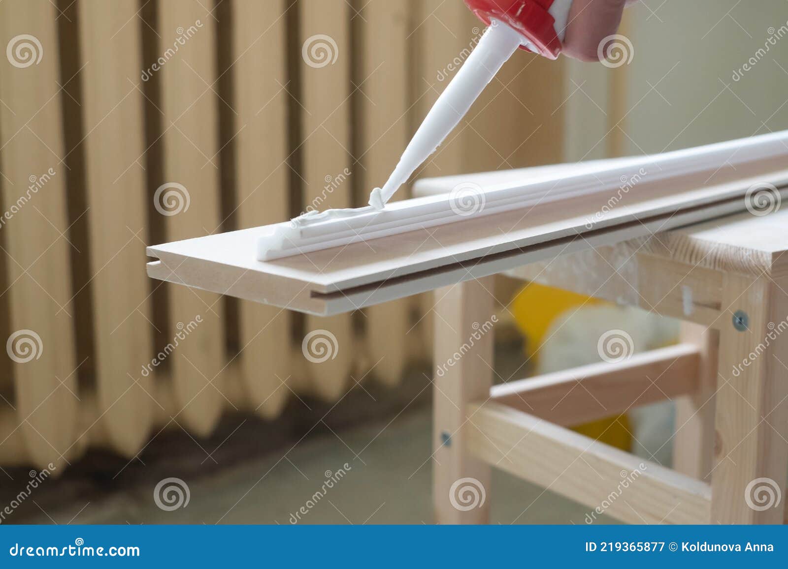 Process of Installing Ceiling Skirting Board. Place Glue on it Stock ...