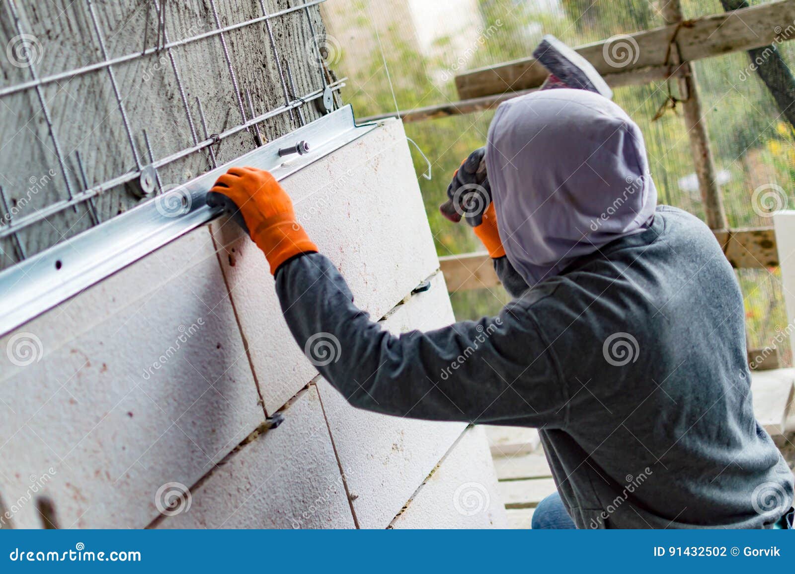 The Process of Installing Metal Angles To the Wall Stock Photo - Image ...