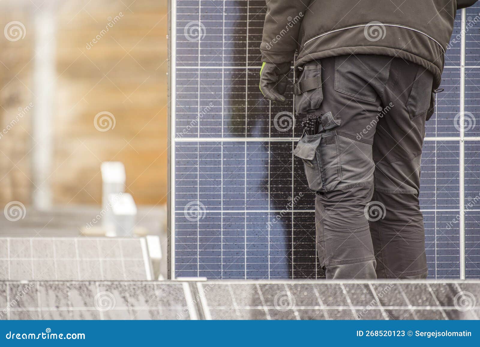 The Process of Installing Solar Panels. Solar Panel Installers Work on ...