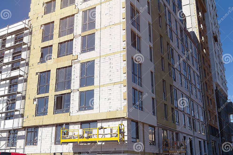 The Process of Insulating External Walls in a Multi-storey Building Under Construction Stock ...