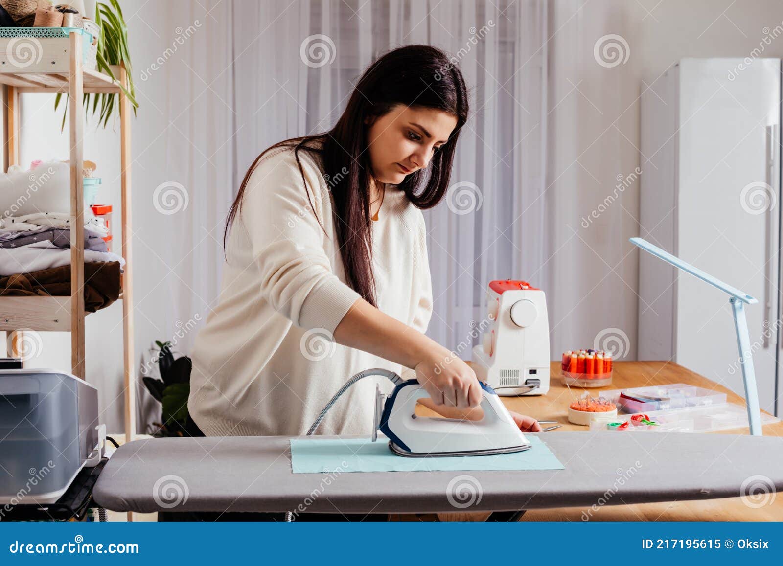 Process of Ironing Textile before Cutting the Pattern and Sewing Stock ...