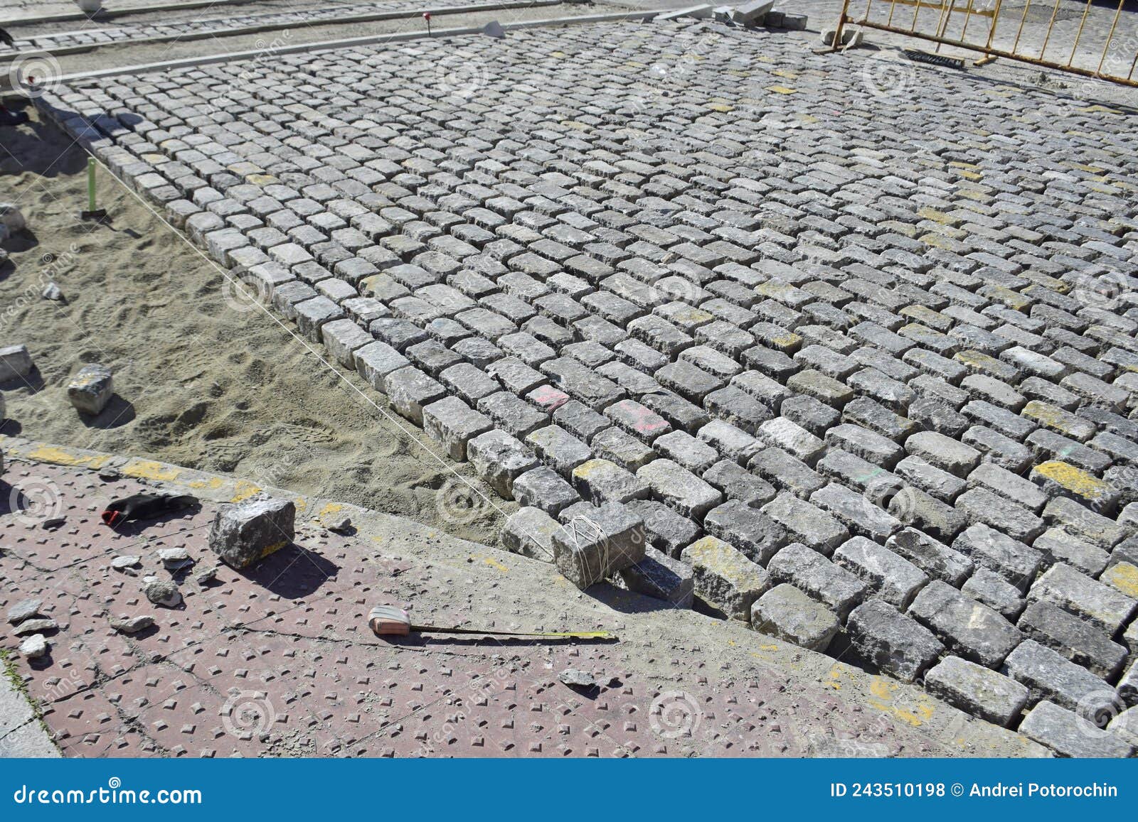The Process of Laying Blocks on a Stone Pavement. Cadiz Stock Photo ...