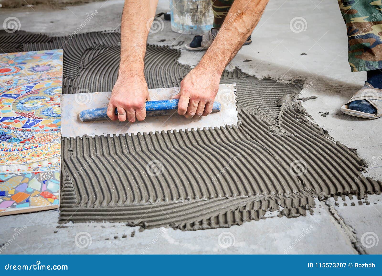 Laying floor ceramic tile stock image. Image of decorate - 115573207