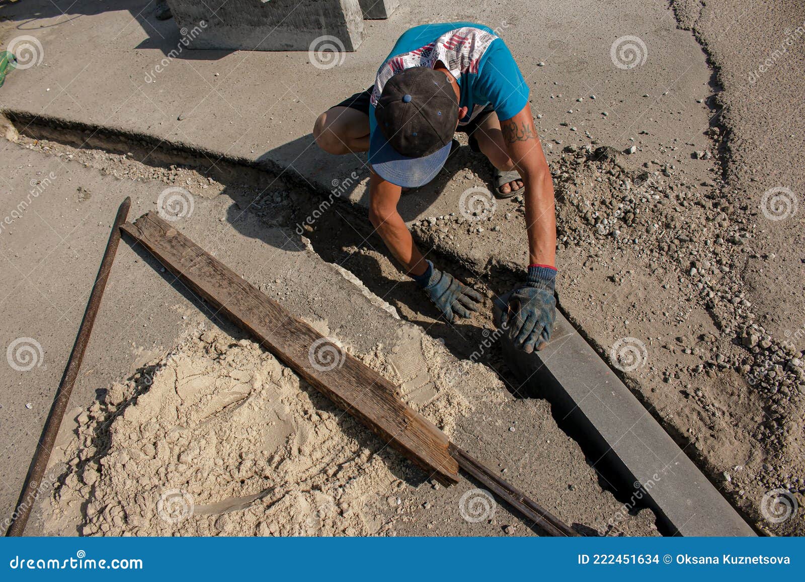 The Process of Laying the Sidewalk Curb. Workers Prepare a Trench for ...