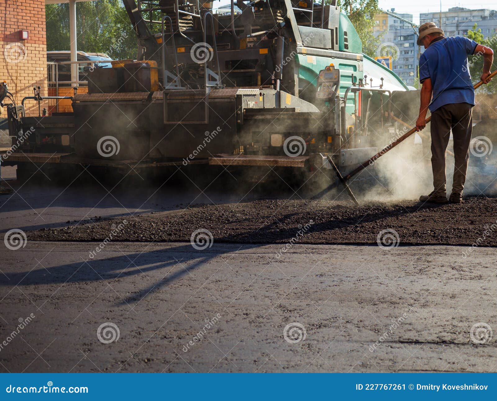 Process of Leveling the Asphalt Manually Using a Special Rake. Stock ...