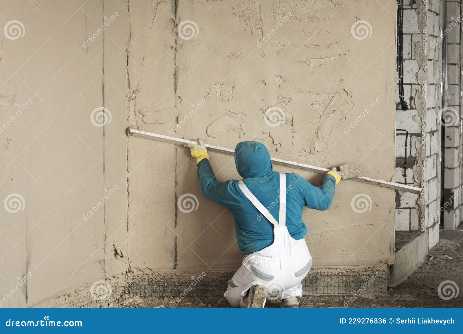 The Process of Leveling Plaster by the Rule after Application by ...