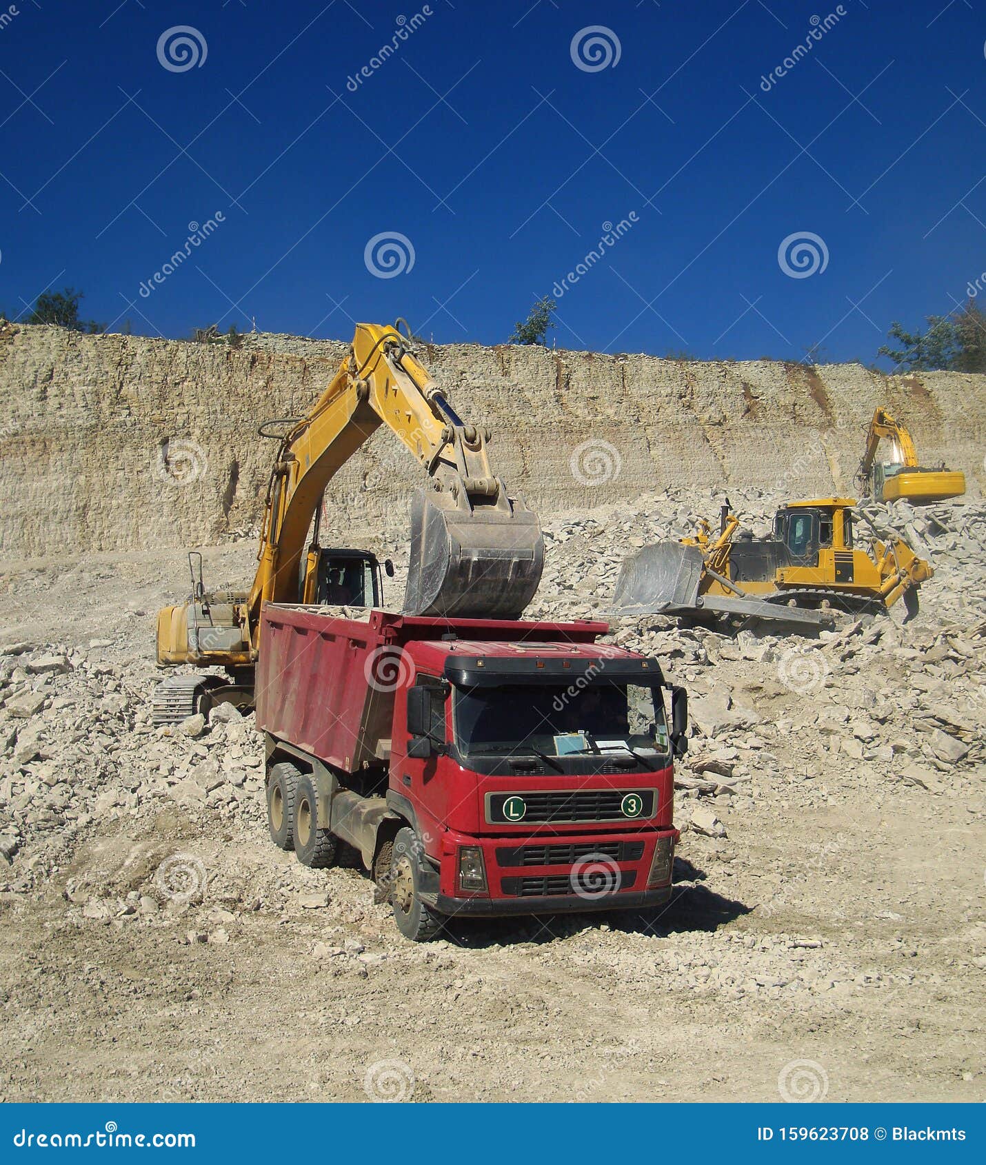 Loading of Crushed Stone in a Dump Truck at the Quarry Stock Photo ...