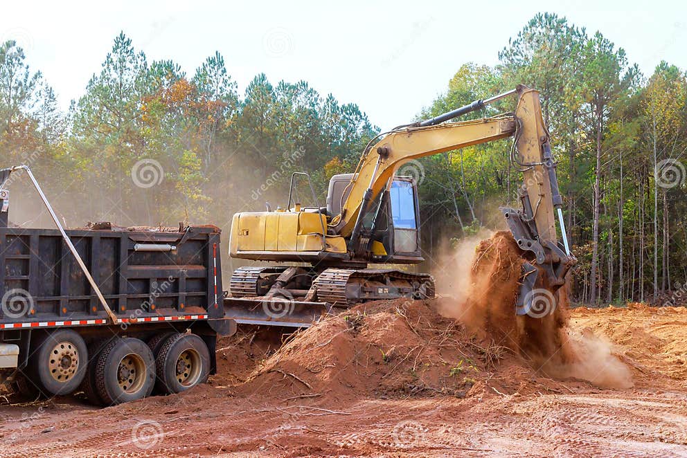 Process of Loading Earth into Dump Truck Using an Excavator at a ...