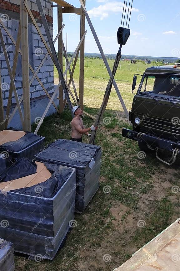 The Process of Loading and Unloading Using a Mobile Crane Blocks and ...