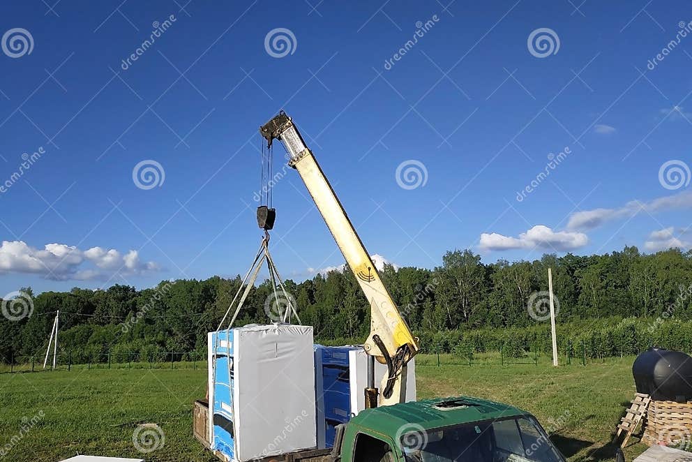 The Process of Loading and Unloading Using a Mobile Crane Blocks and ...