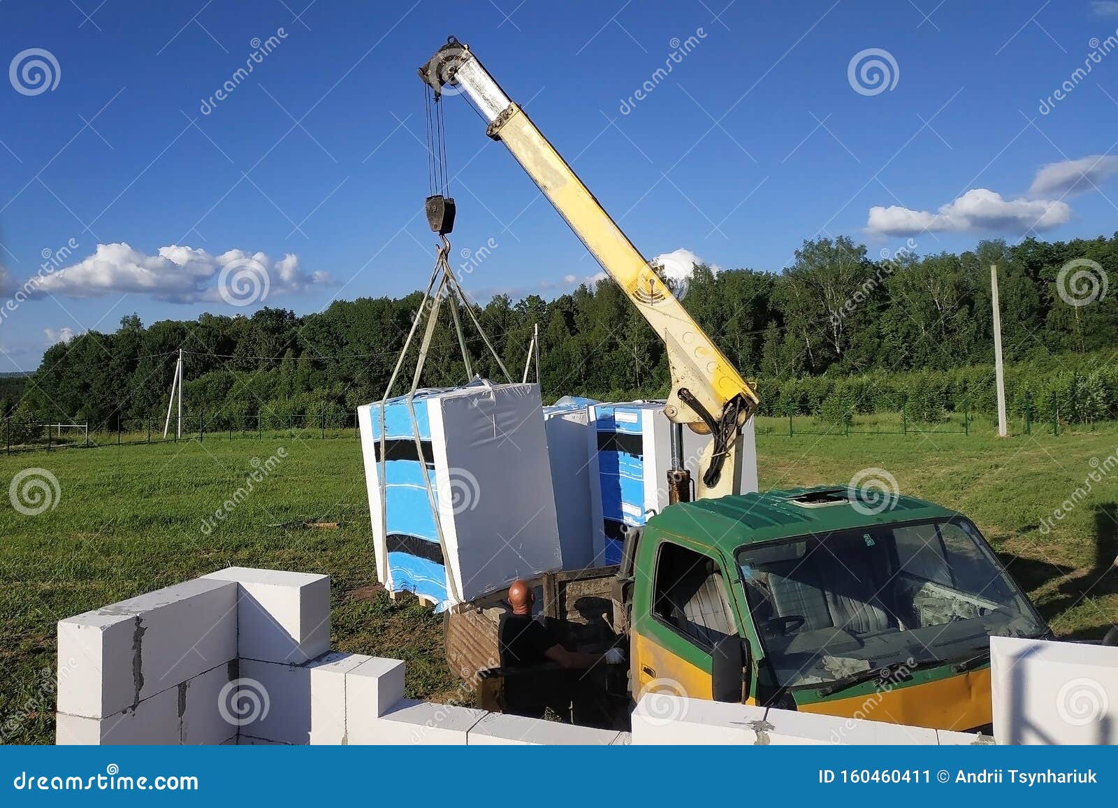 The Process of Loading and Unloading Using a Mobile Crane Blocks and ...