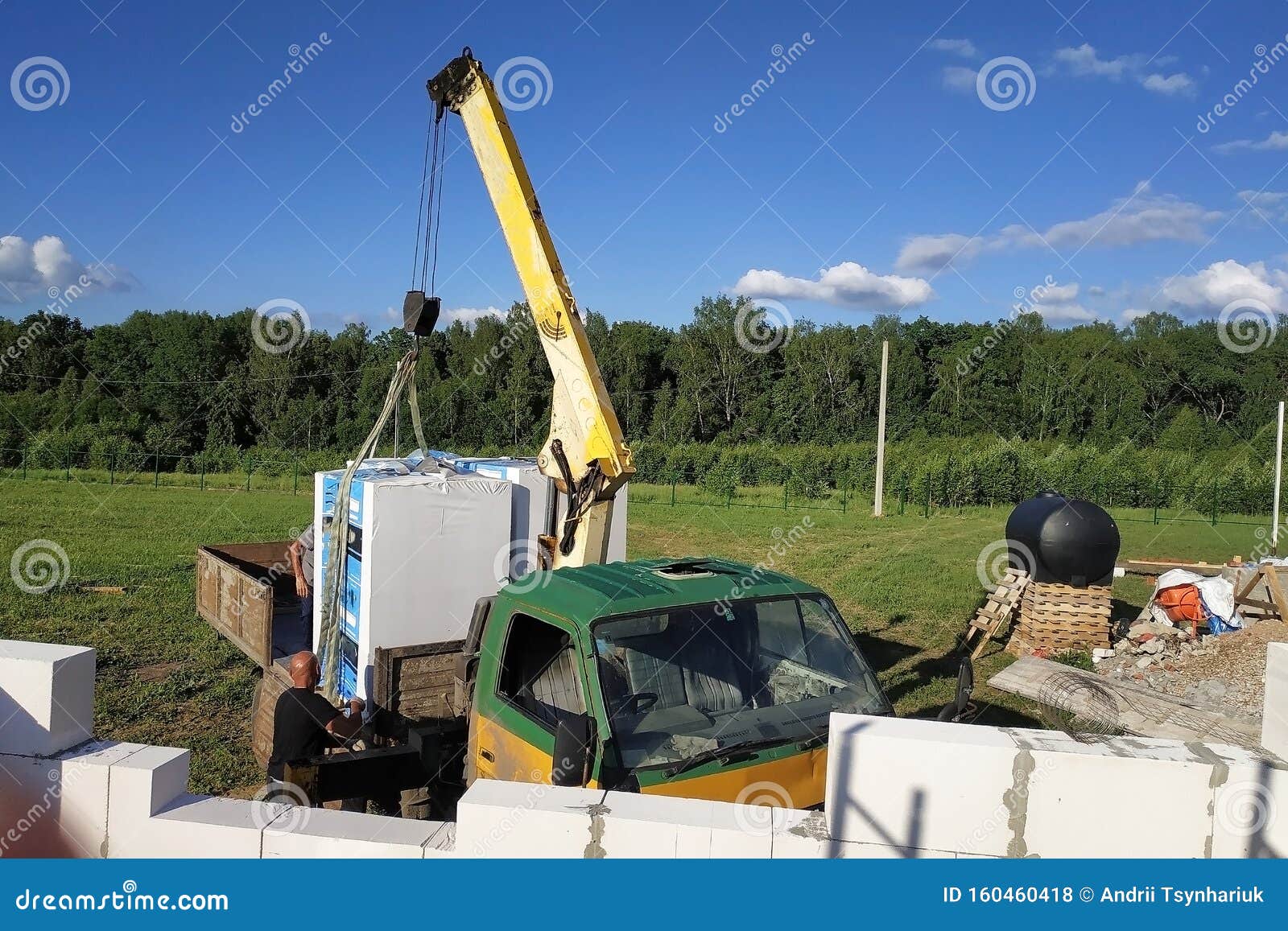 The Process of Loading and Unloading Using a Mobile Crane Blocks and ...