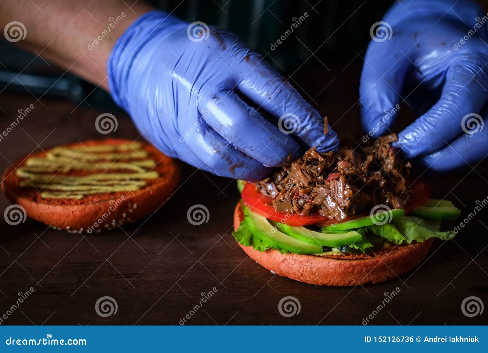 Process of Making Burger. Chef Hands in Gloves Cooking Beefburger with ...