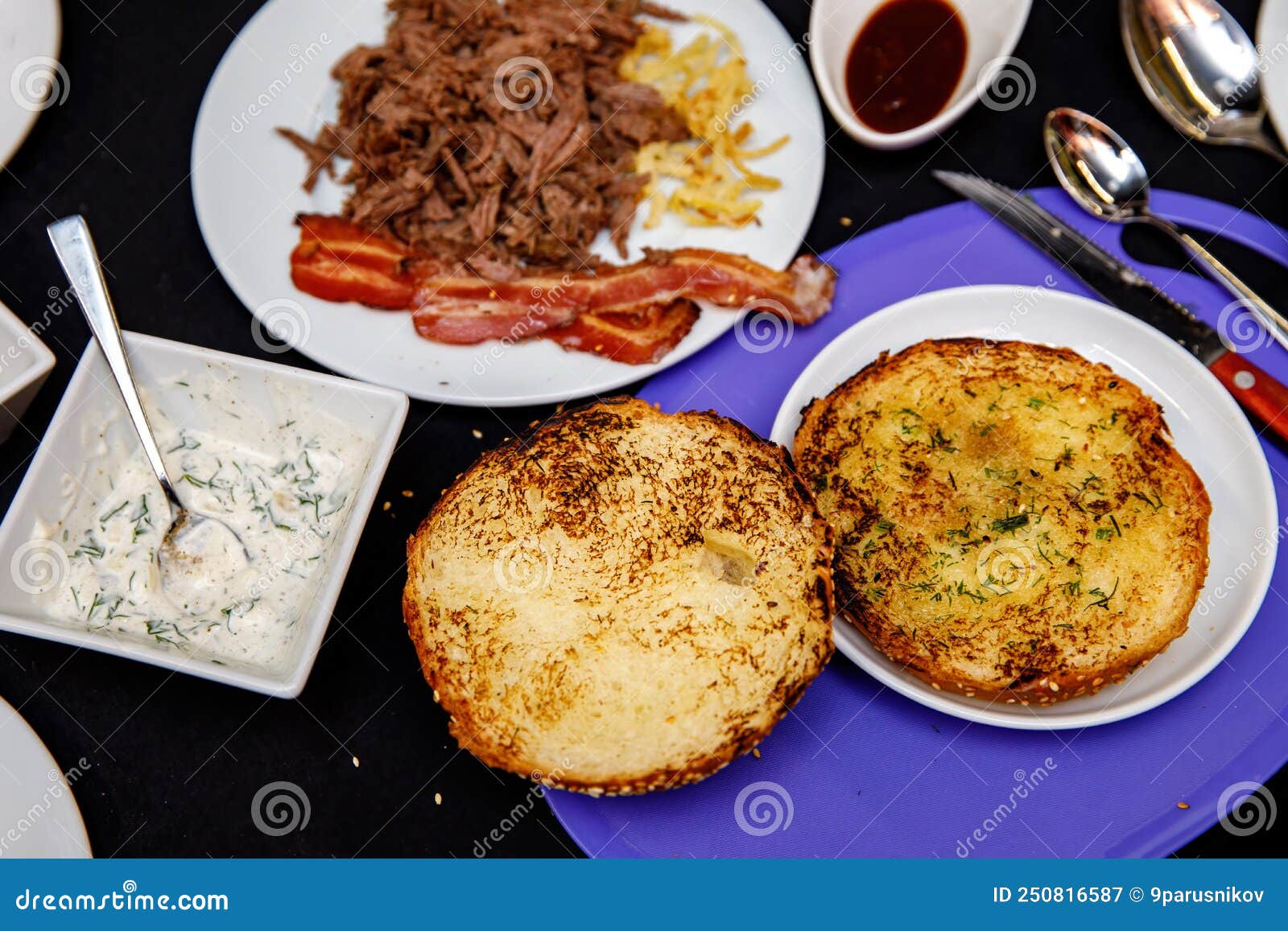 The Process of Making a Burger in a Restaurant Kitchen. Close-up of ...