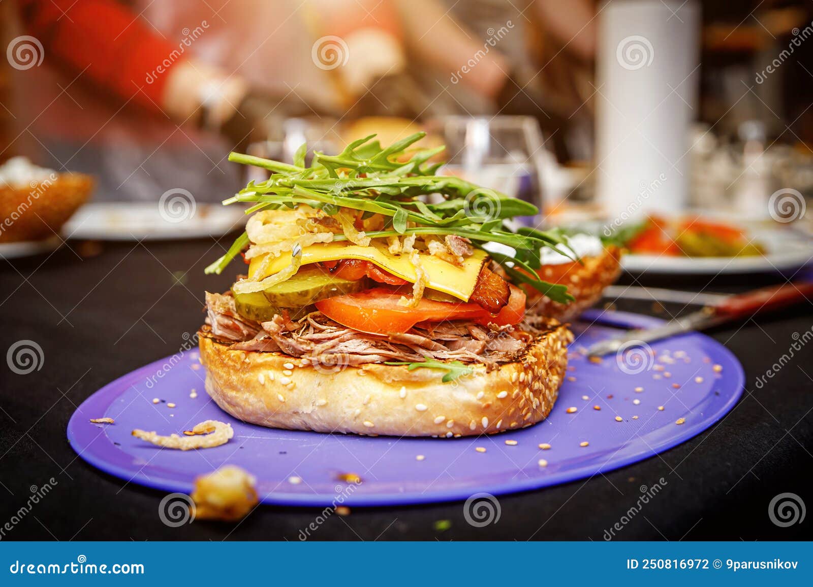 The Process of Making a Burger in a Restaurant Kitchen. Side View of ...