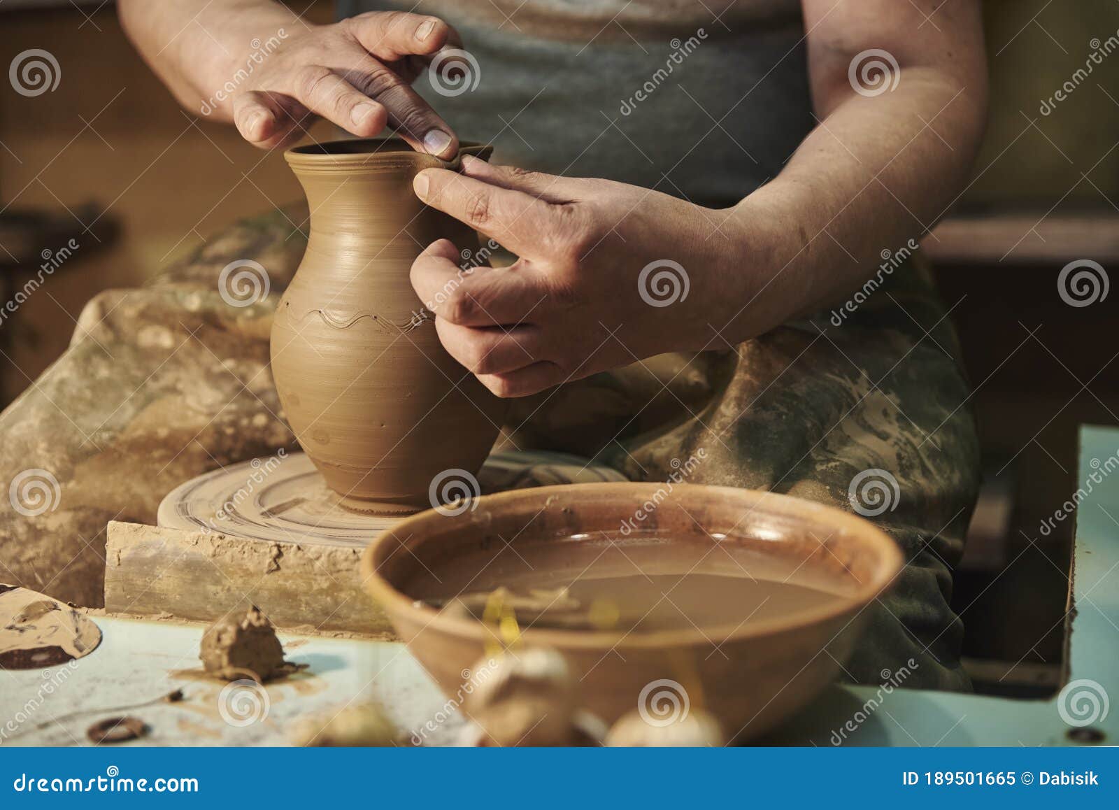Process of Making Clay Pot on Potter`s Wheel in Workshop. Potter at ...