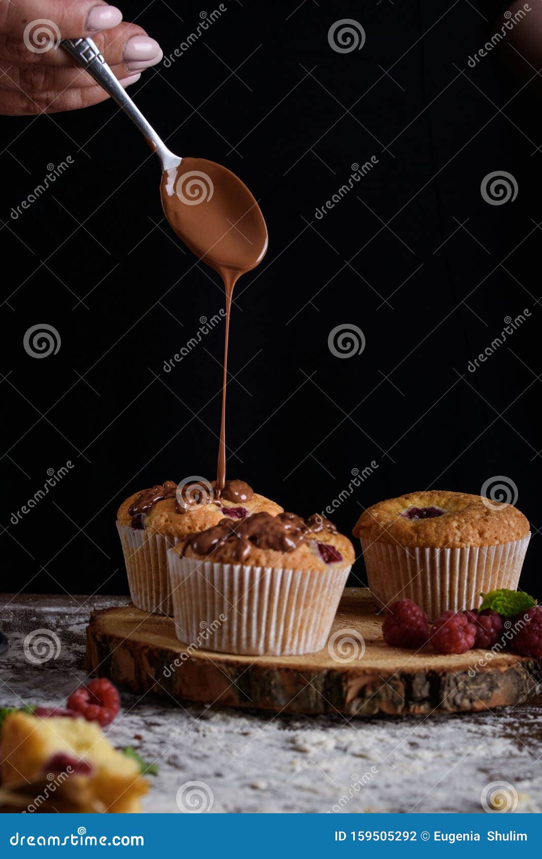 The Process of Making Cupcakes, Coating a Cream from a Pastry Bag in ...