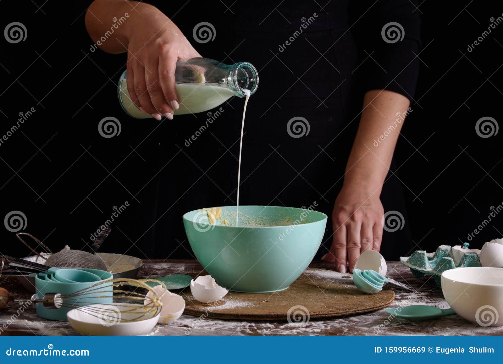 The Process of Making Cupcakes, Coating a Cream from a Pastry Bag in ...
