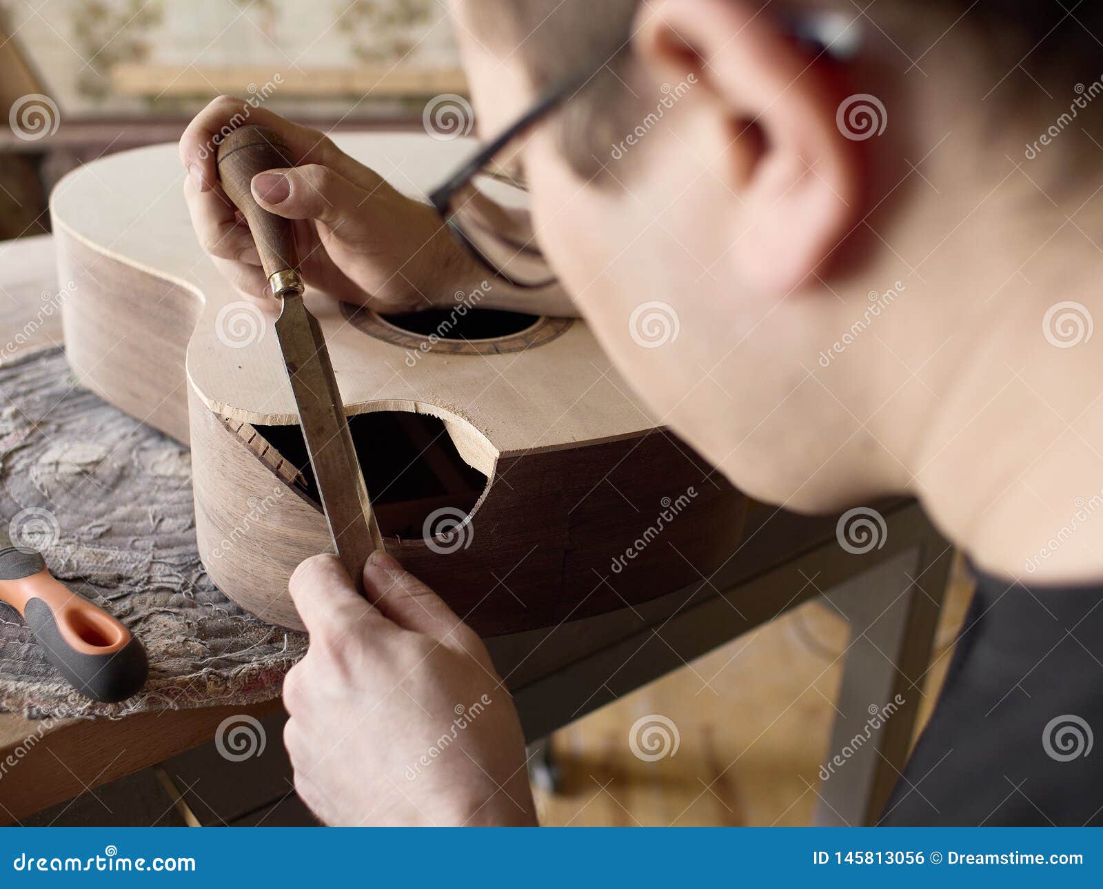 The Process of Making a Cutaway on Classical Guitar. Stock Photo ...