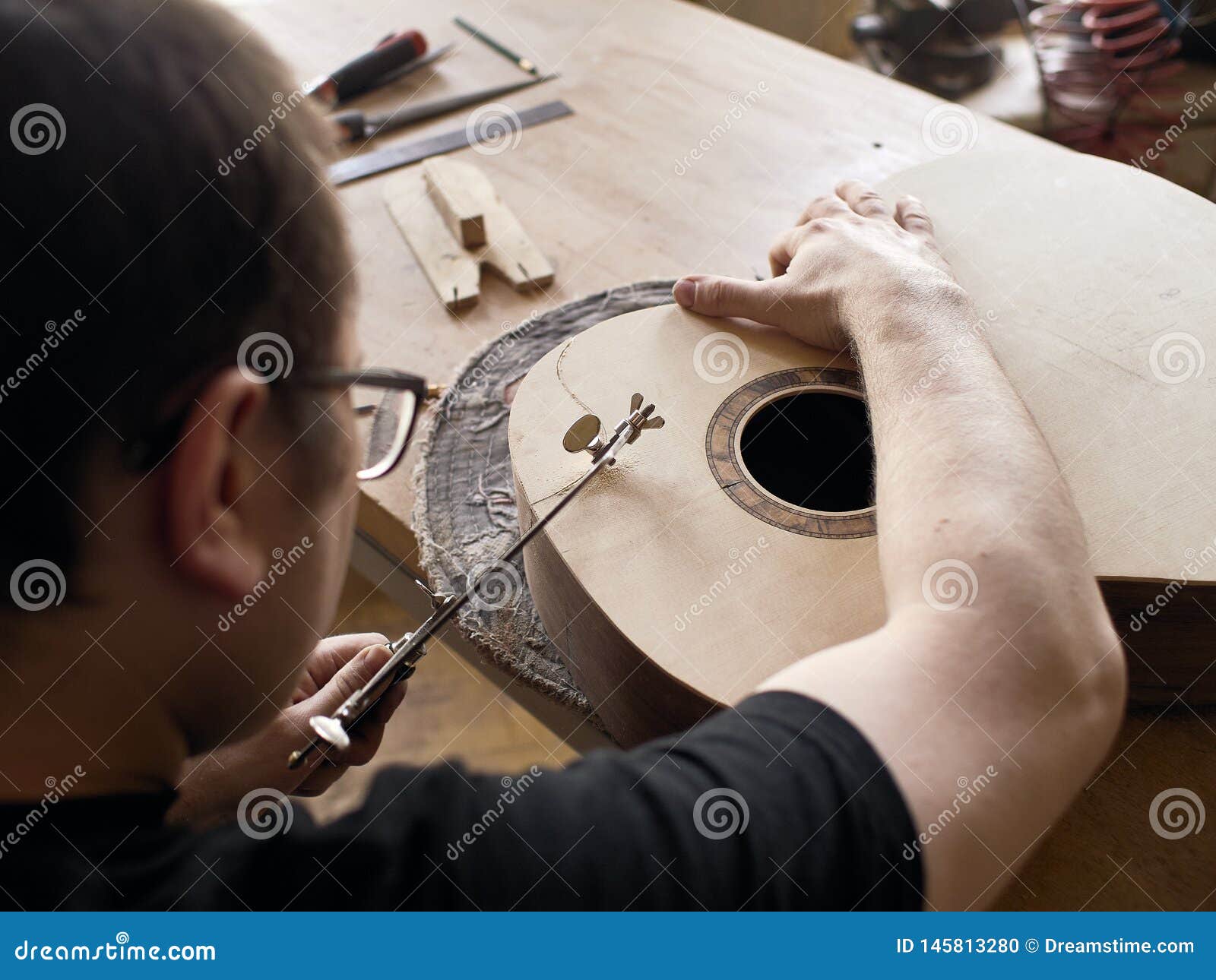 The Process of Making a Cutaway on Classical Guitar. Stock Photo ...