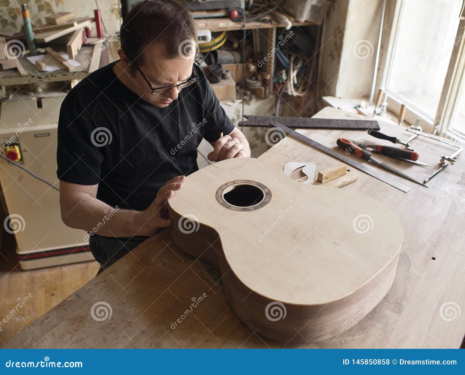 The Process of Making a Cutaway on Classical Guitar. Stock Photo ...