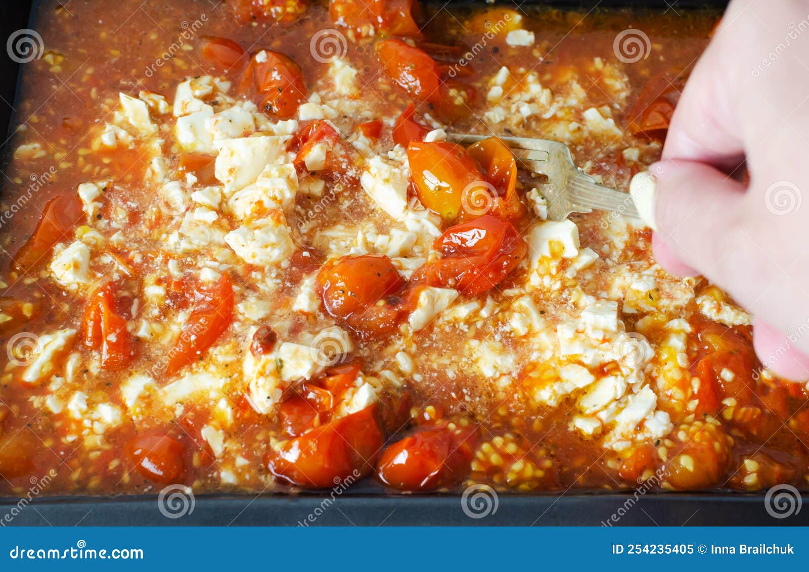 The Process of Making Feta Pasta. Baked Cheese and Tomatoes with Herbs ...