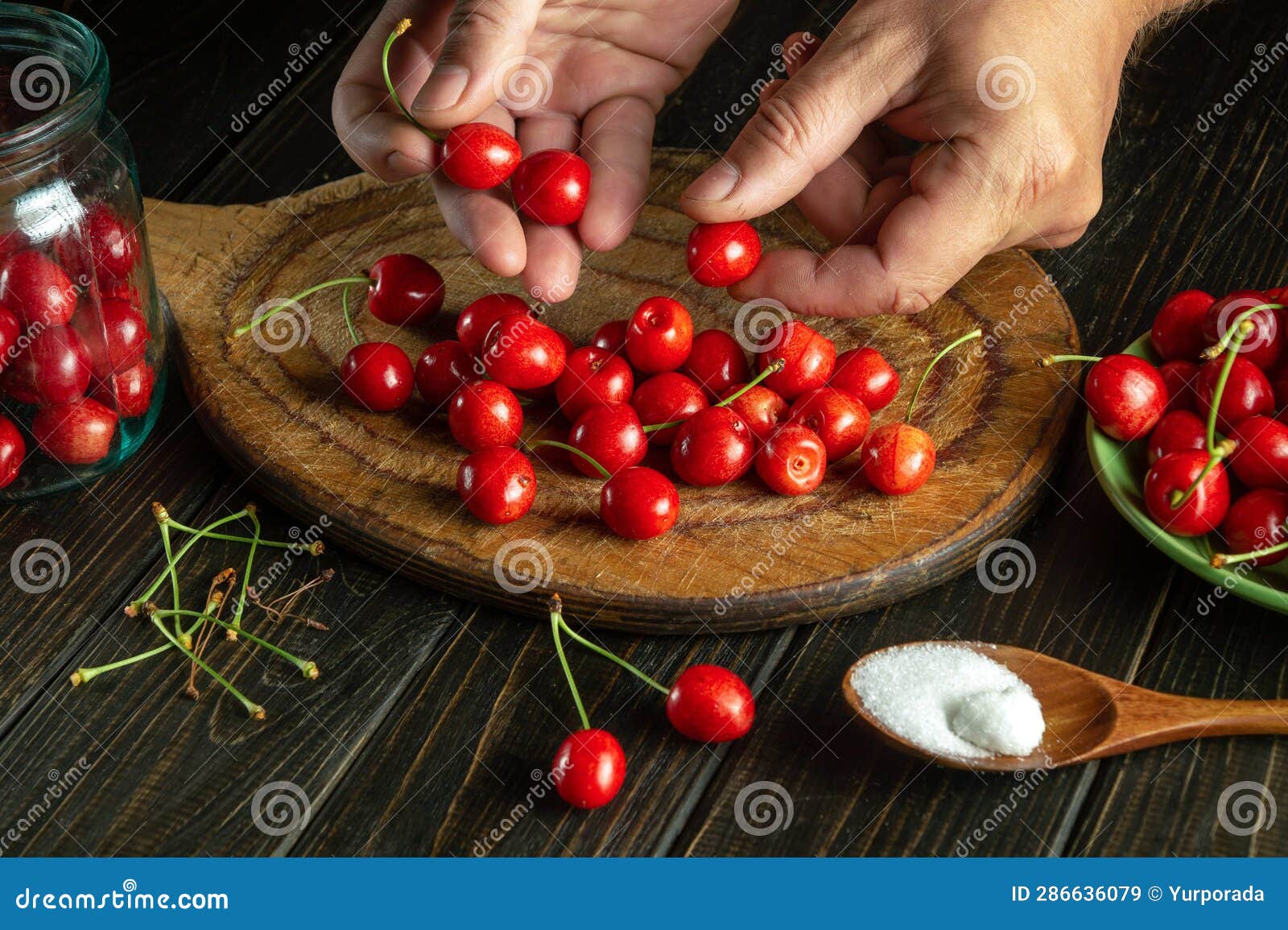 The Process of Making Fruit Drink from Fresh Cherries on the Kitchen ...
