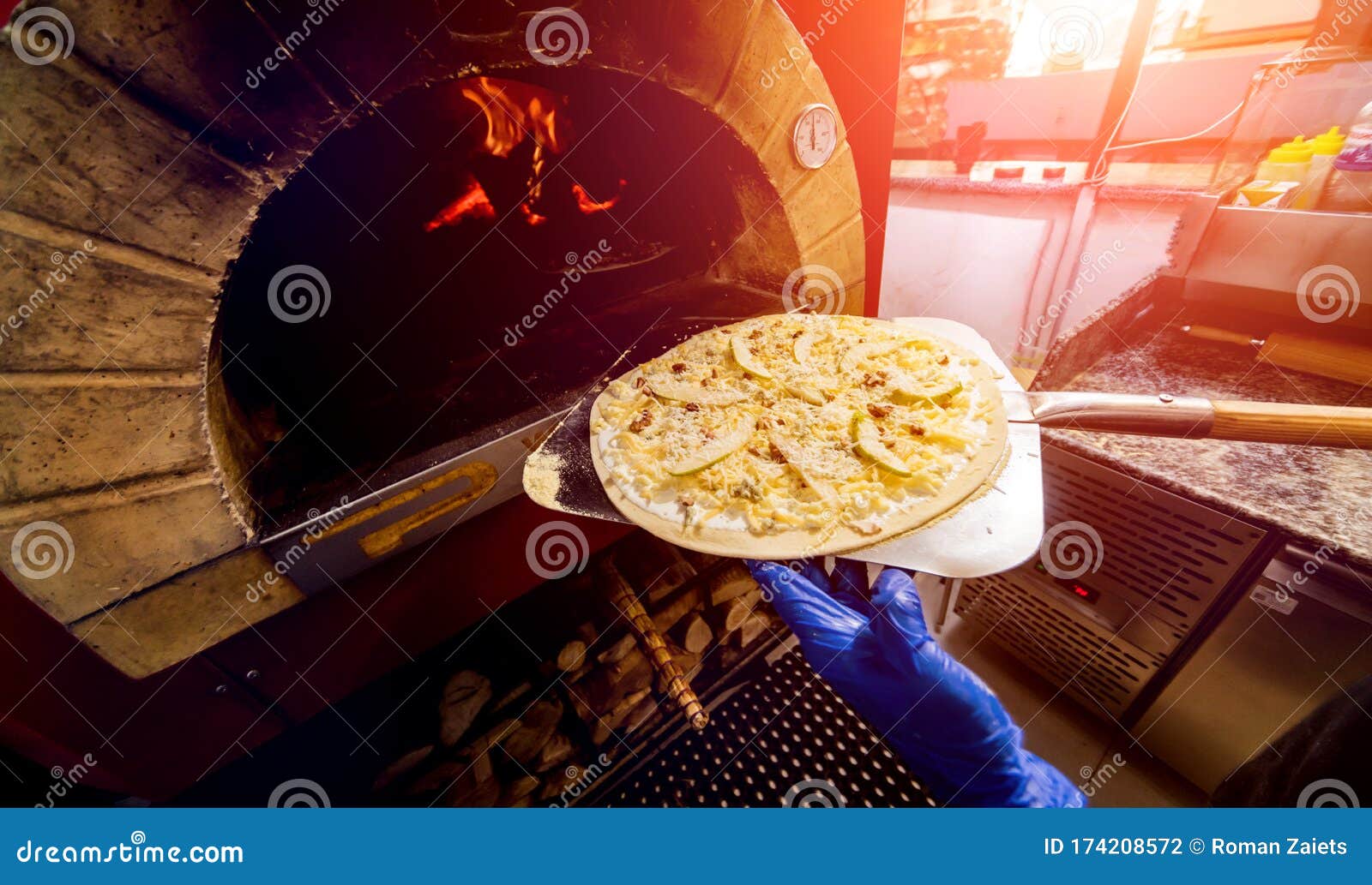 The Process of Making Pizza. Chef Baker Puts Raw Pizza in the Oven ...