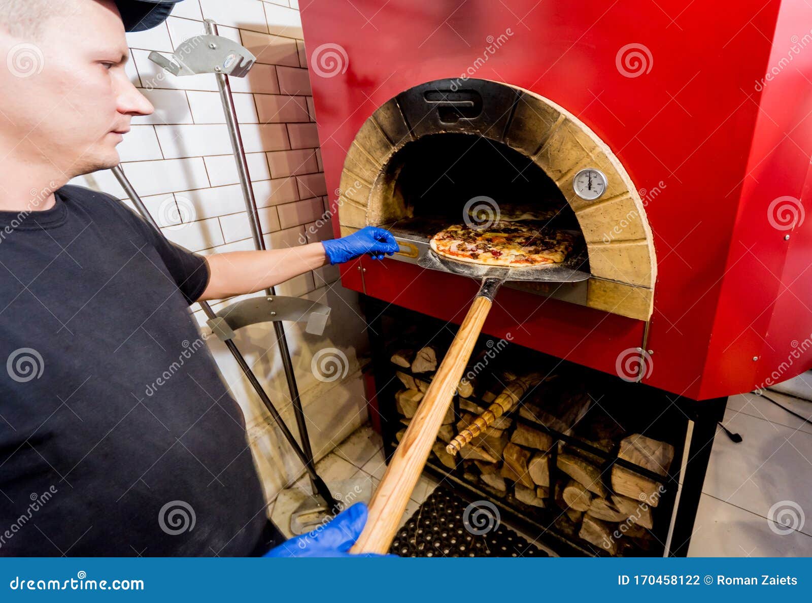 The Process of Making Pizza. Chef Baker Puts Raw Pizza in the Oven ...
