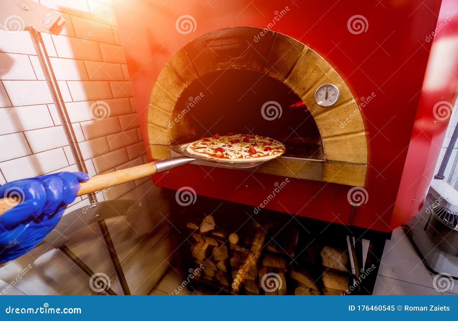 The Process of Making Pizza. Chef Baker Puts Raw Pizza in the Oven ...
