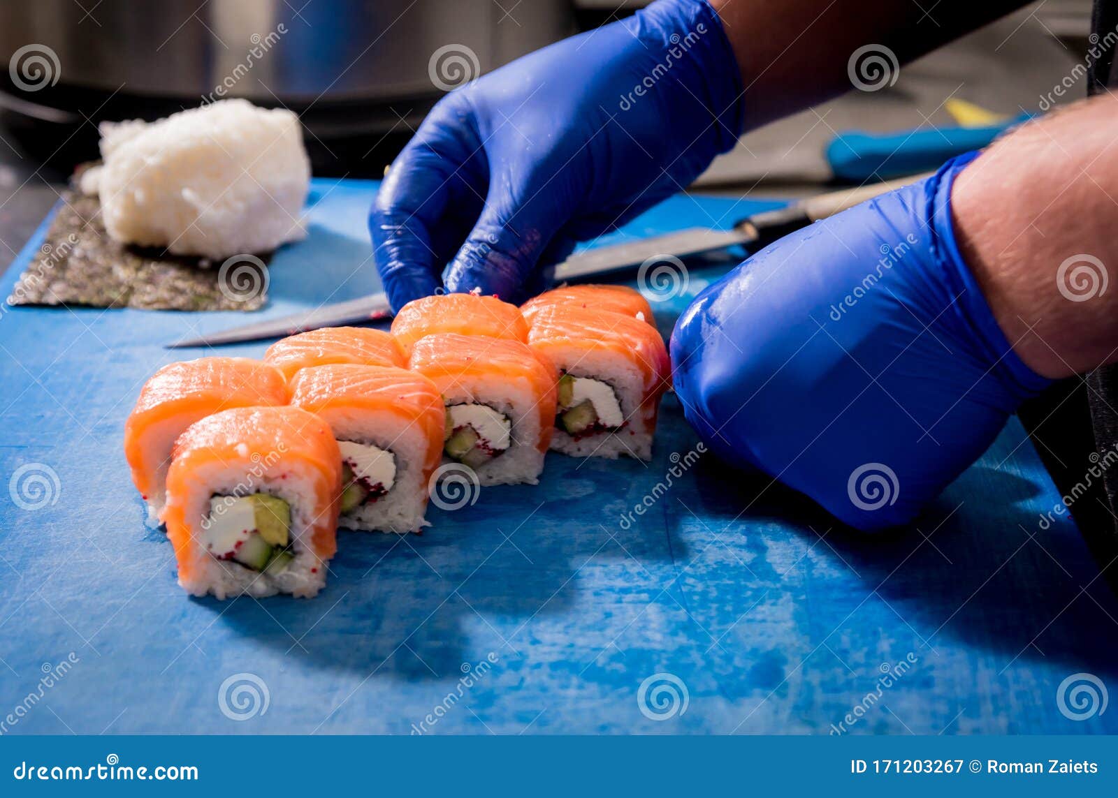 Process of Making Sushi and Rolls at Restaurant Kitchen. Chefs Hands ...