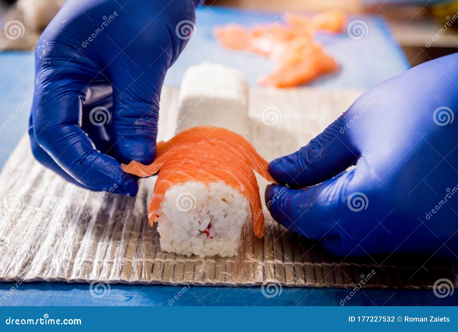 Process of Making Sushi and Rolls at Restaurant Kitchen. Chefs Hands ...