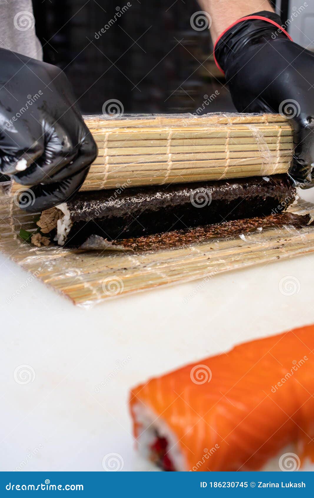 The Process of Making Sushi, Rolls. Wrapping Sushi in a Nori Leaf Stock ...