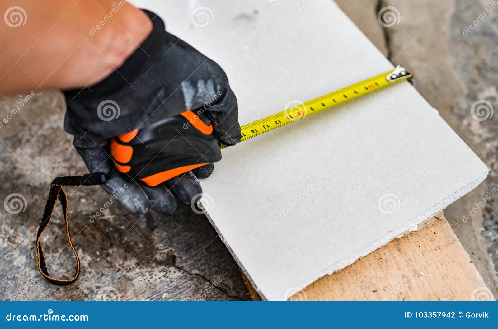 The Process of Measuring the Length of a Sheet of Drywall Stock Photo ...