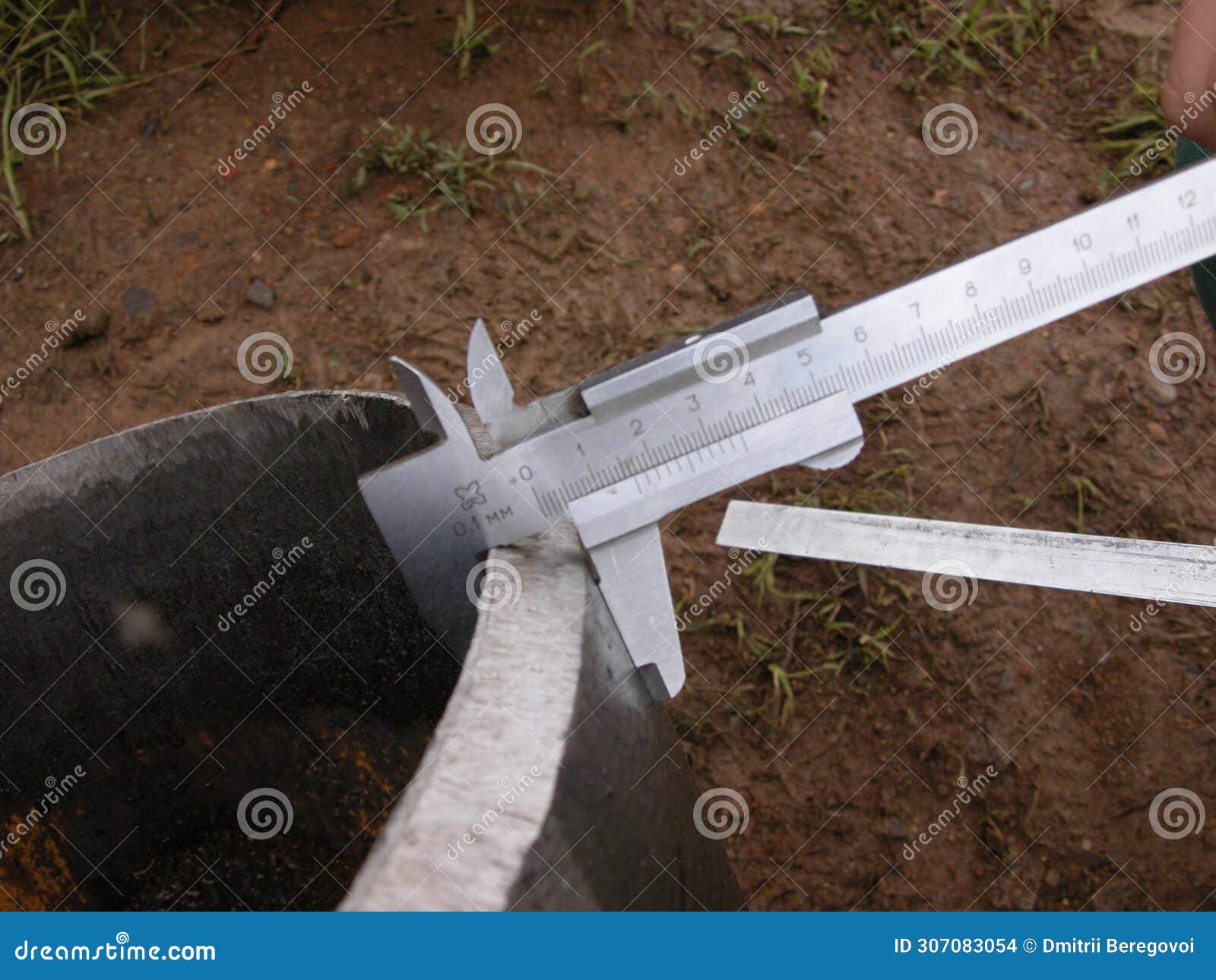 The Process of Measuring Pipe Thickness with a Caliper. Stock Photo ...