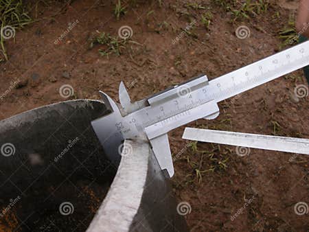 The Process of Measuring Pipe Thickness with a Caliper. Stock Photo ...