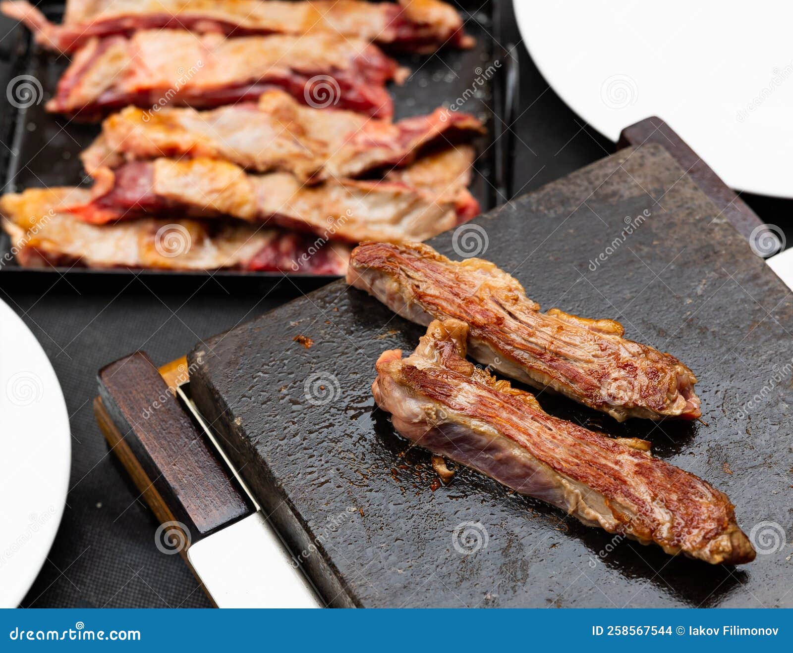 Process of Meat Cooking on Grilling Stone Stock Photo - Image of ...