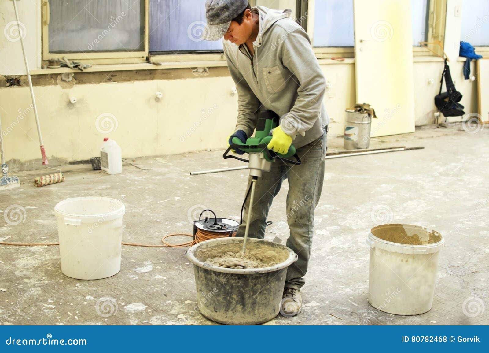 The Process of Mixing Putty Mixture for Construction Stock Photo ...