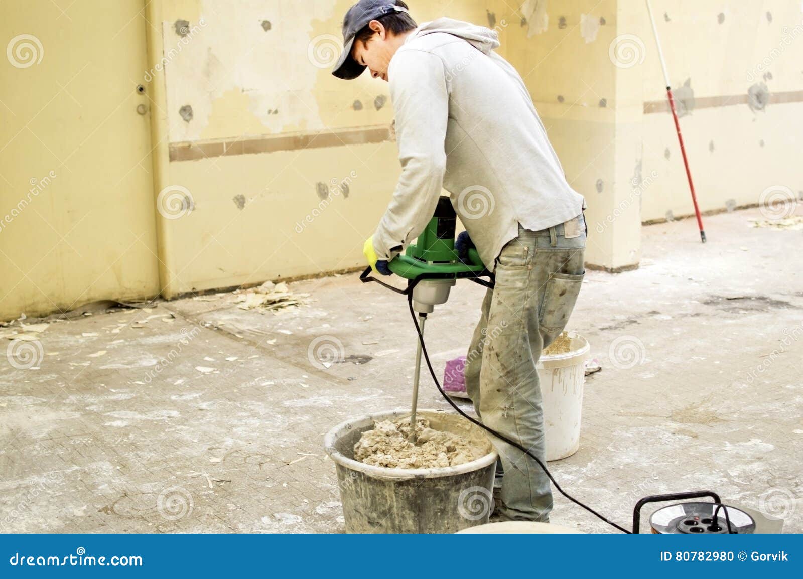 The Process of Mixing Putty Mixture for Construction Stock Photo ...